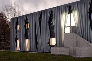 Hertl.Architekten Covers Building in Curtains | Architect Magazine